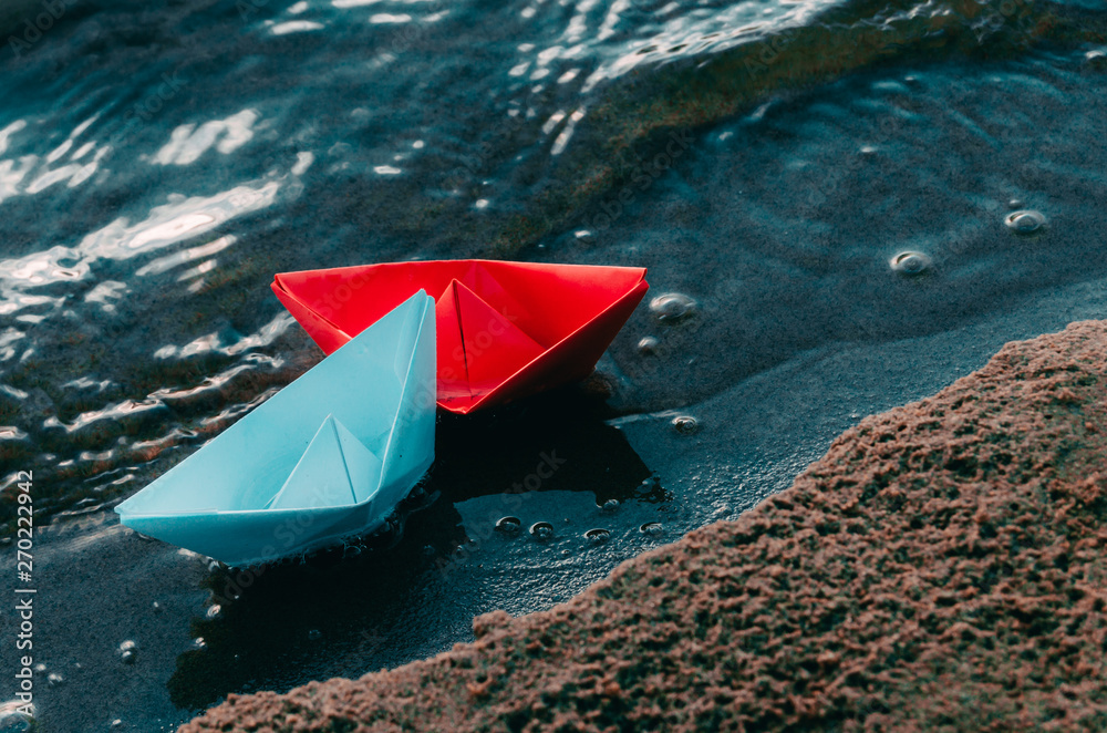 Small,red,paper boat is shipwrecked in a turbulent raging sea. Stock ...