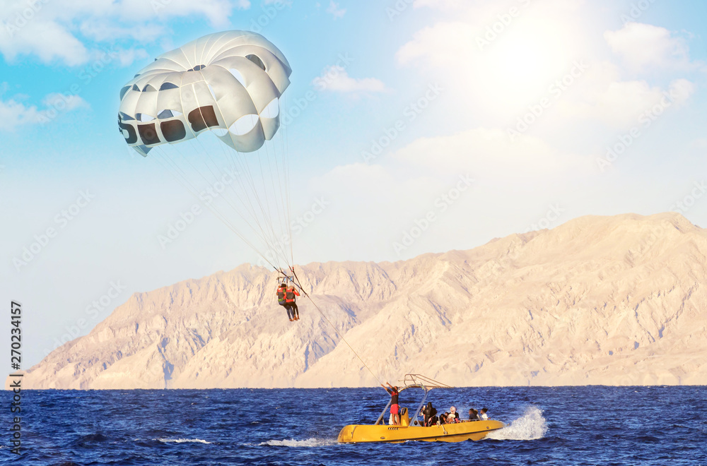 Air parachute in the sky. Water parachute on three places. Parasailing ...