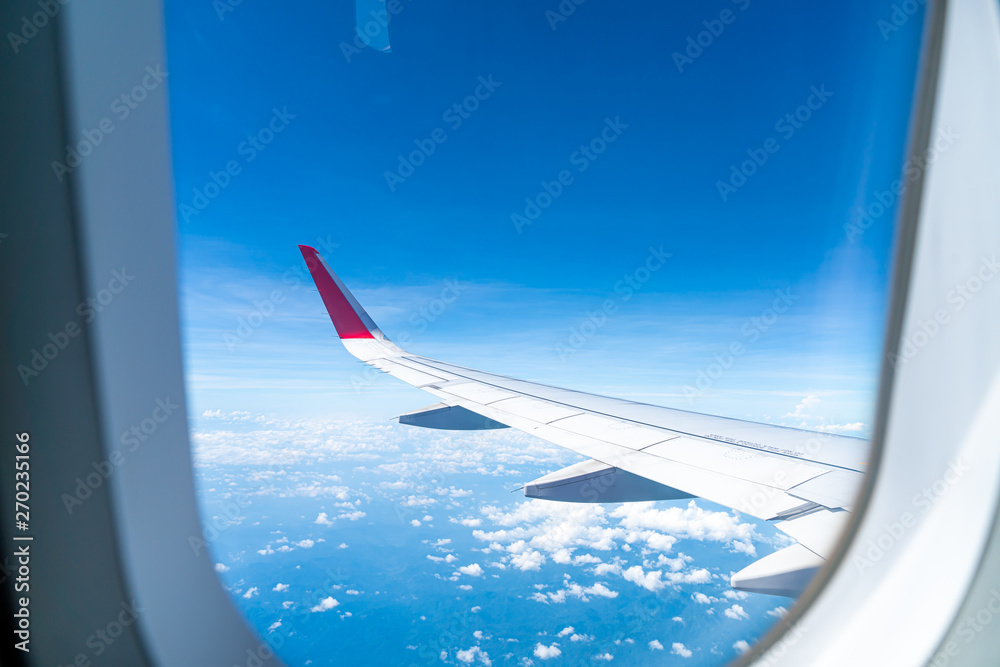 Clouds and sky as seen through window of an aircraft 스톡 사진 | Adobe Stock