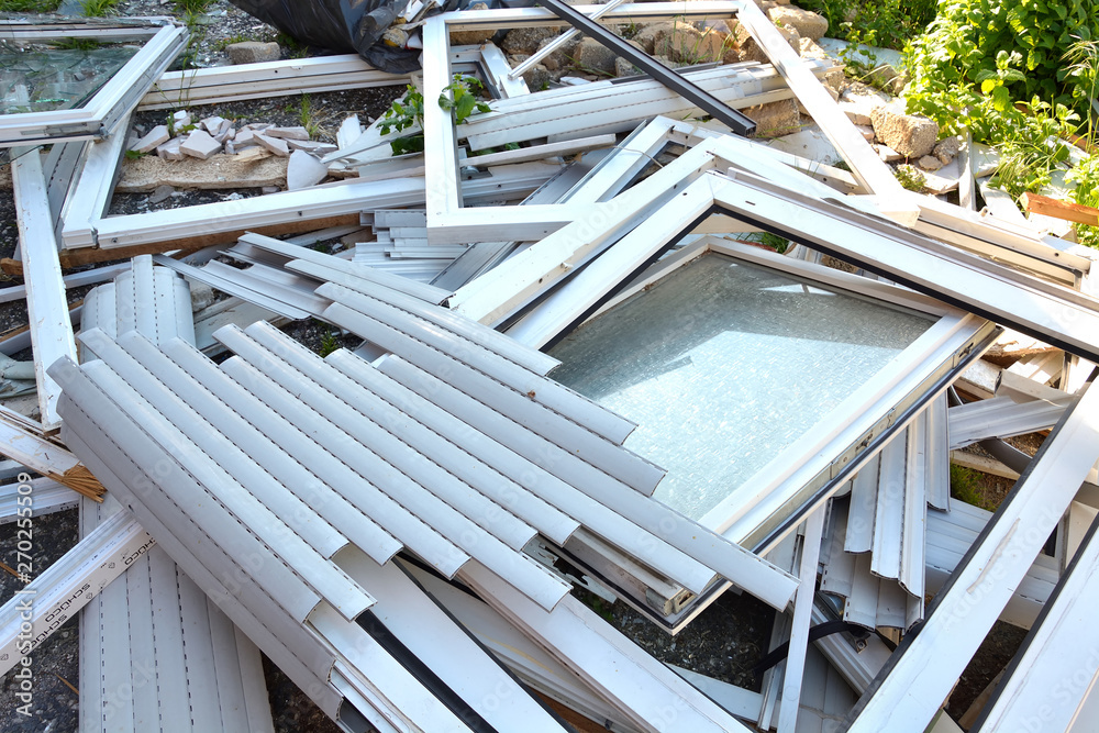Many different construction debris from old plastic window frames of ...