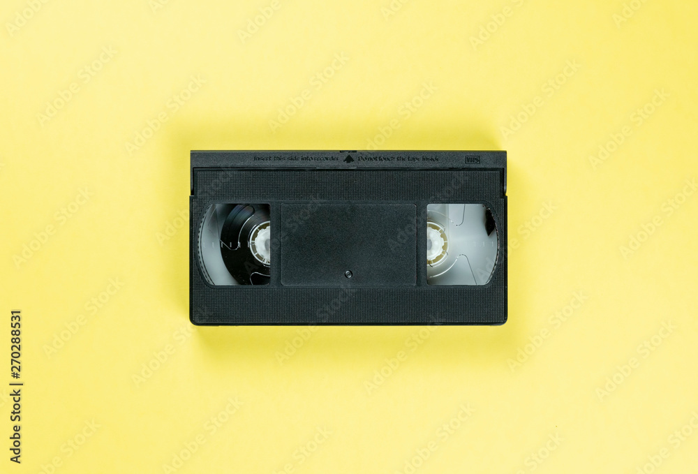 retro vhs video tape cassette on yellow background Stock Photo | Adobe ...