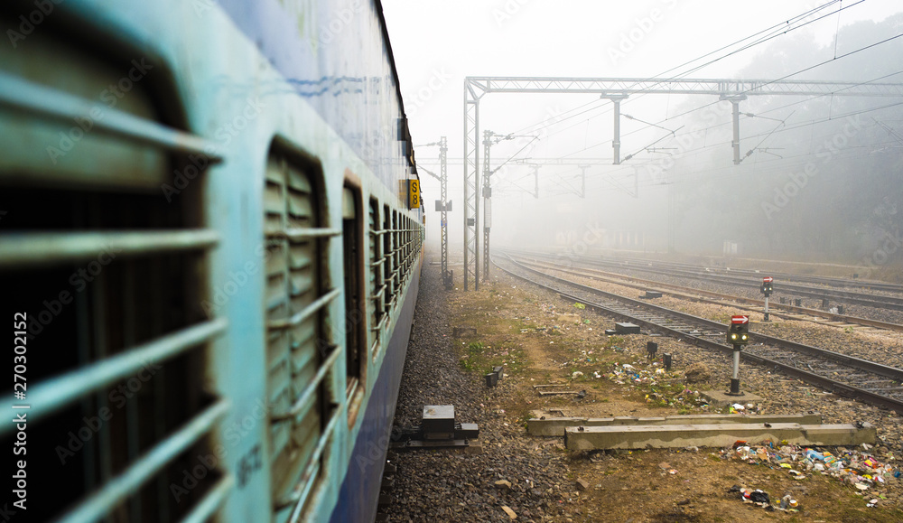 View through the window train in the polluted city of New Delhi, India ...