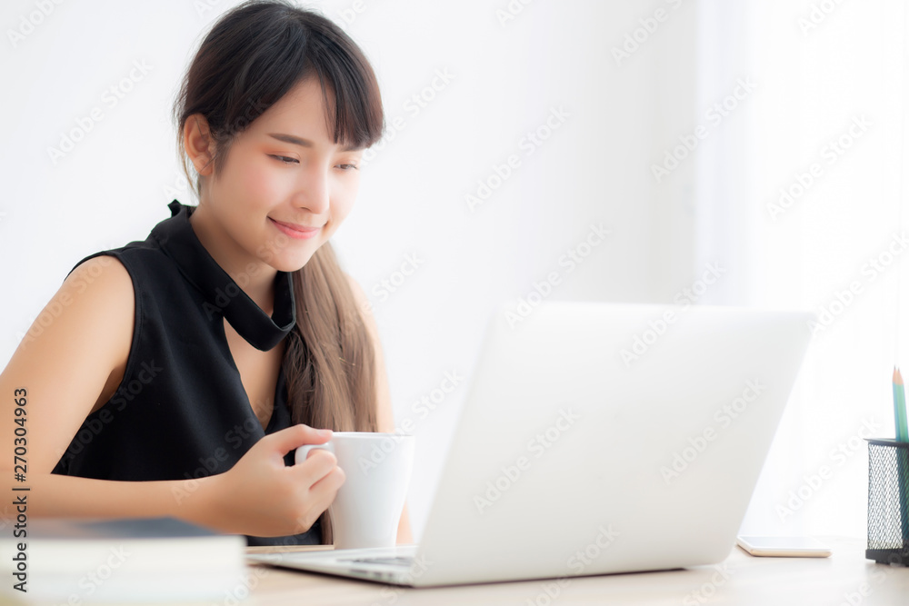 Beautiful Young Freelance Asian Woman Smiling Working And On Laptop