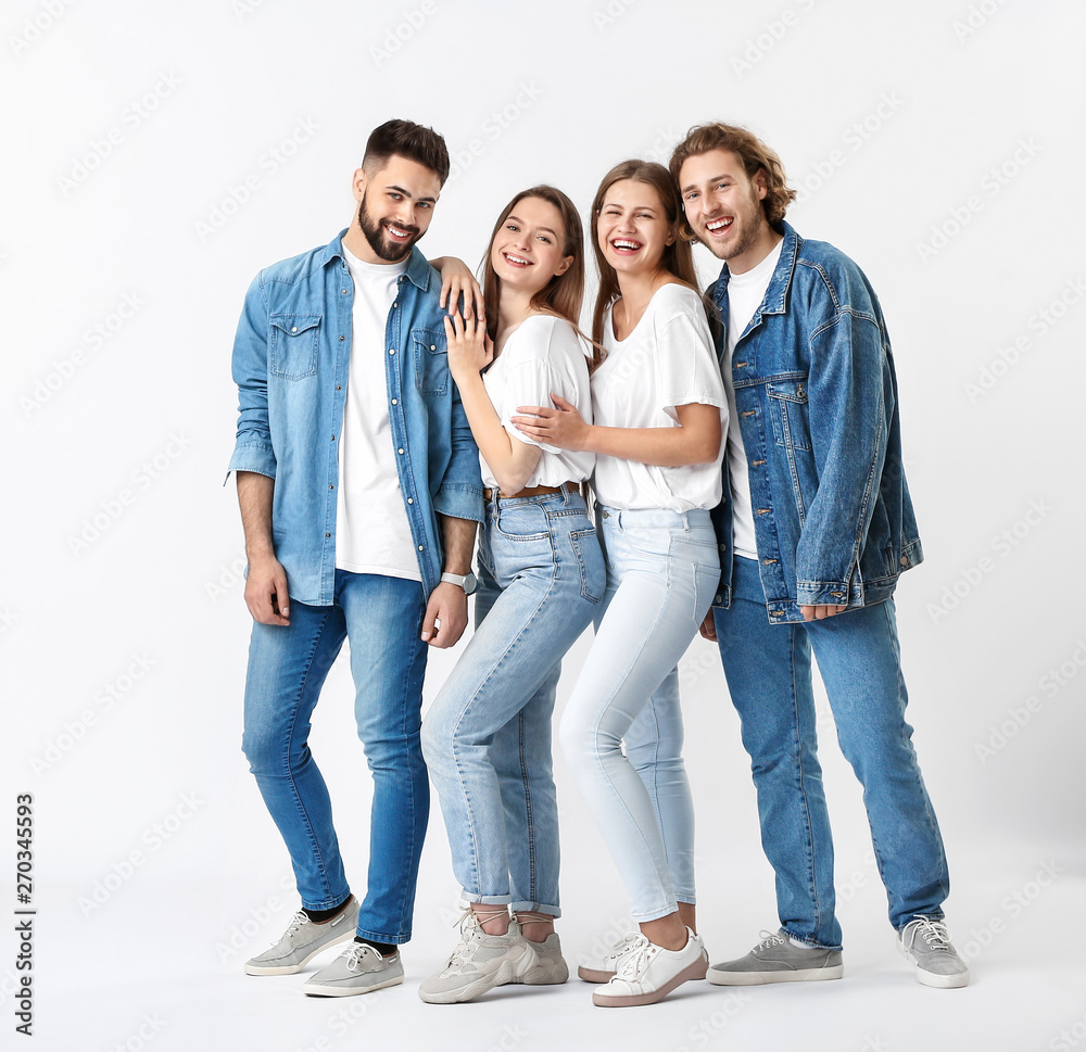 Stylish young people in jeans clothes on white background Stock Photo ...