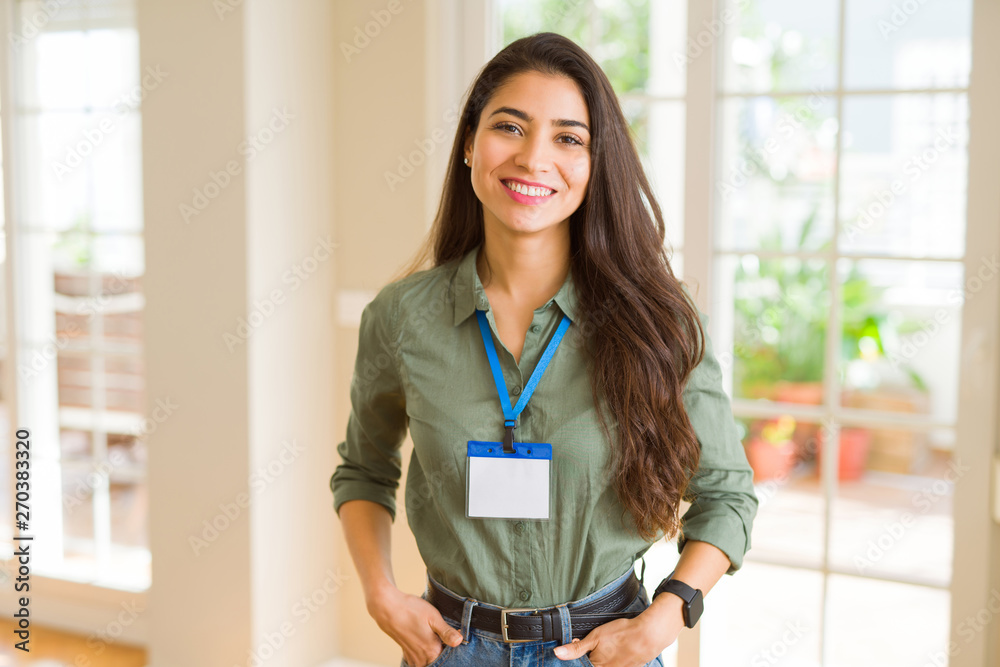 Beautiful young business woman wearing id card Stock Photo | Adobe Stock