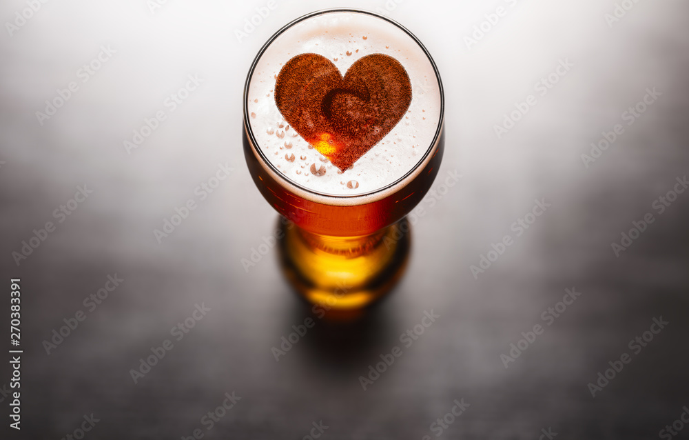 Foto de Loving beer concept. Heart symbol on beer glass foam on black ...