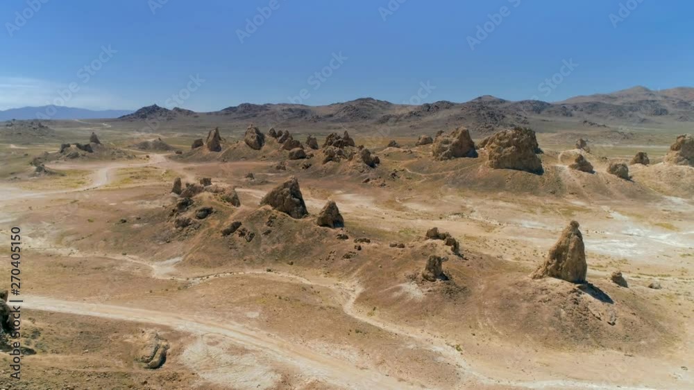 TRONA PINNACLES, CALIFORNIA, USA. Tufa cluster rising from arid soil ...