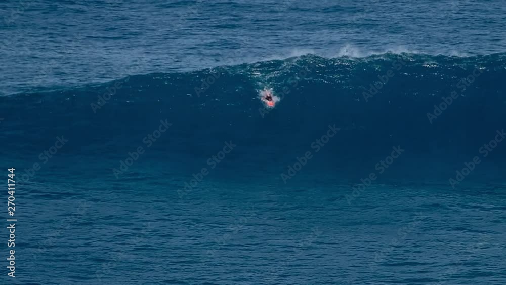 Surfer rides the giant wave at the famous Jaws (Peahi) surf spot in Maui, Hawaii Stock Video ...