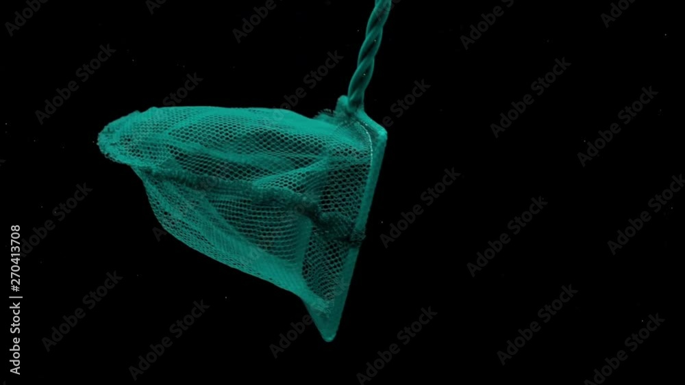 Scoop-net floating under transparent water on black background. Hoop ...