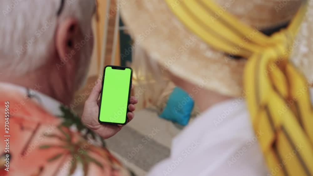 Shot back of elderly hands using smartphone on green screen man woman ...