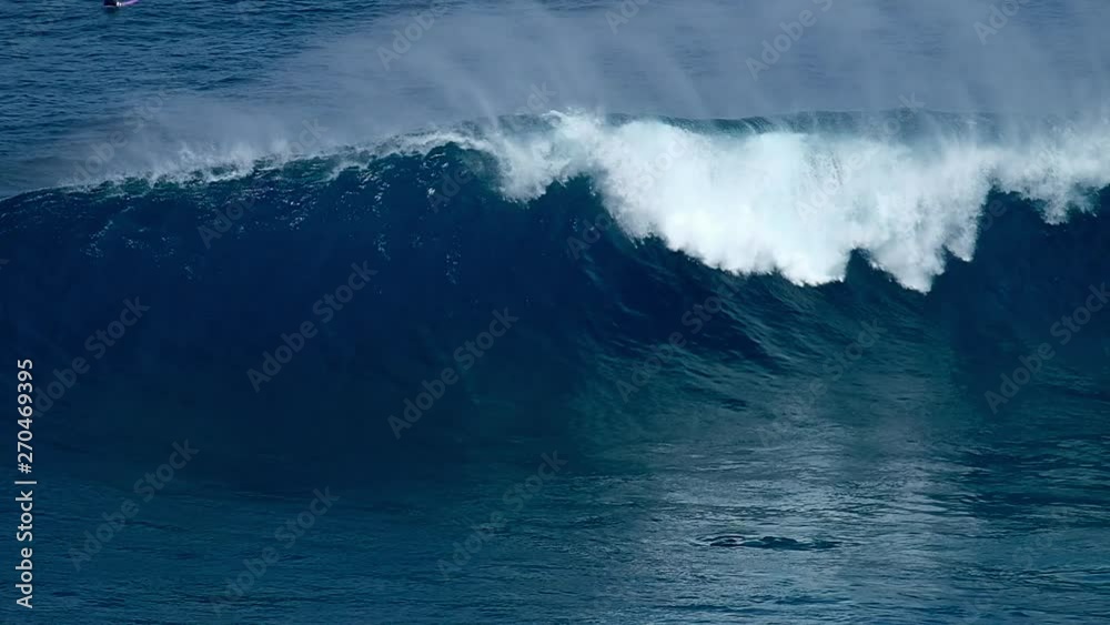 Giant ocean wave breaks at the famous Jaws (Peahi) surf spot in Maui ...