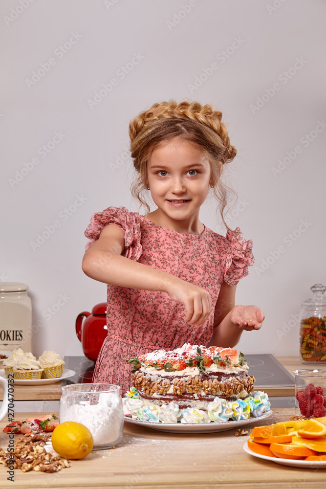 Little girl is making a homemade cake with an easy recipe at kitchen ...