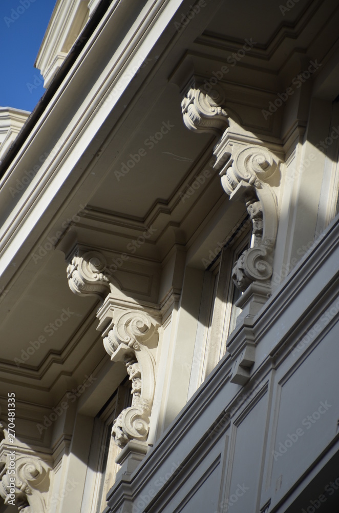 architectural detail of a baroque church window and pilasters sculpture ...