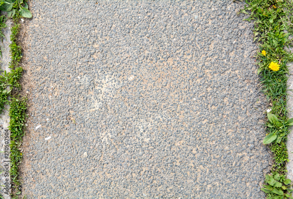Texture of rough asphalt road with grass and flowers of Dandelion at ...