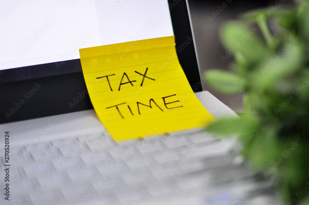 Foto Stock Tax Season: Horizontal top right view of an office laptop ...