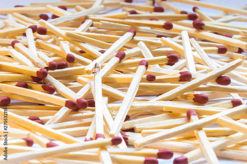 Close-up of a pile of matches scattered around the table with brown ...