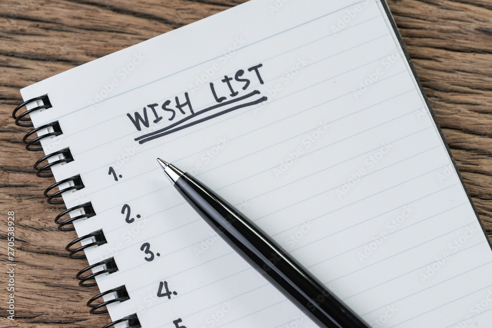 Foto de Wish list concept, pen on white paper note pad with handwritten ...