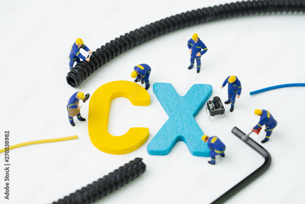 CX, Customer Experience concept, miniature figure worker building ...