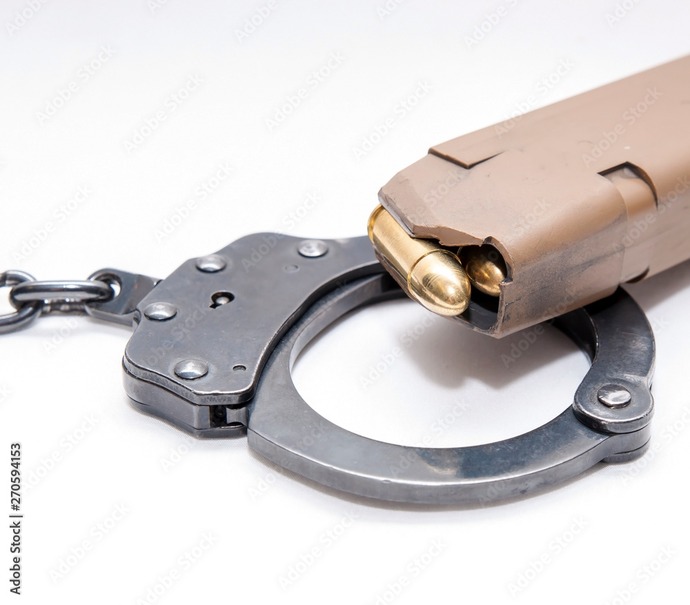 A brown pistol magazine loaded with 9mm full metal jacket bullets on ...