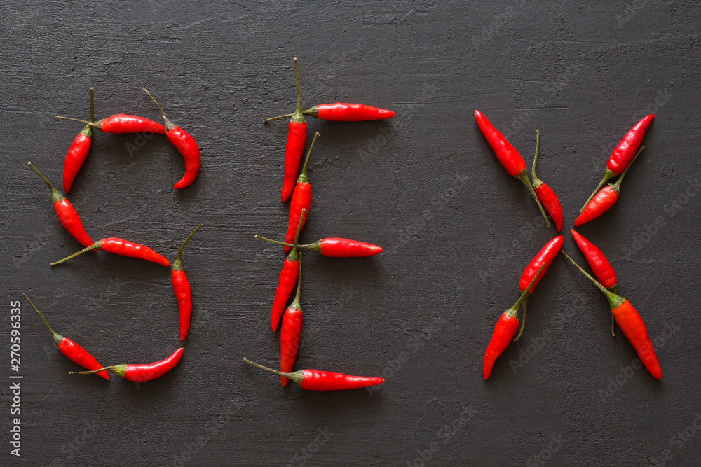Word Sex Red Hot Chili Peppers On Black Background On Black Table Swx