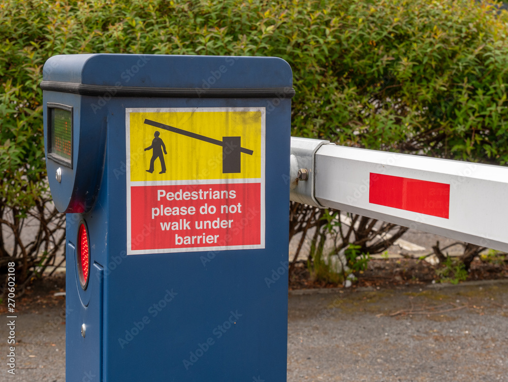 Sign warning pedestrians not to walk underneath Photos | Adobe Stock