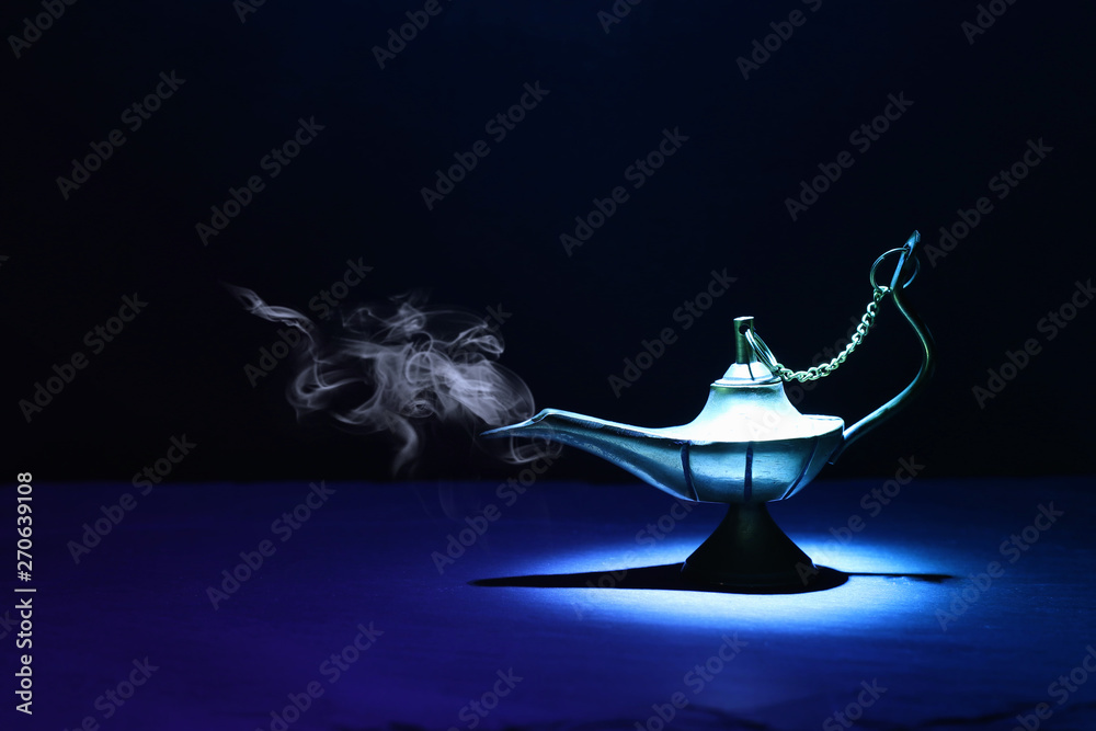 Image of magical mysterious aladdin lamp with smoke. Dark background ...