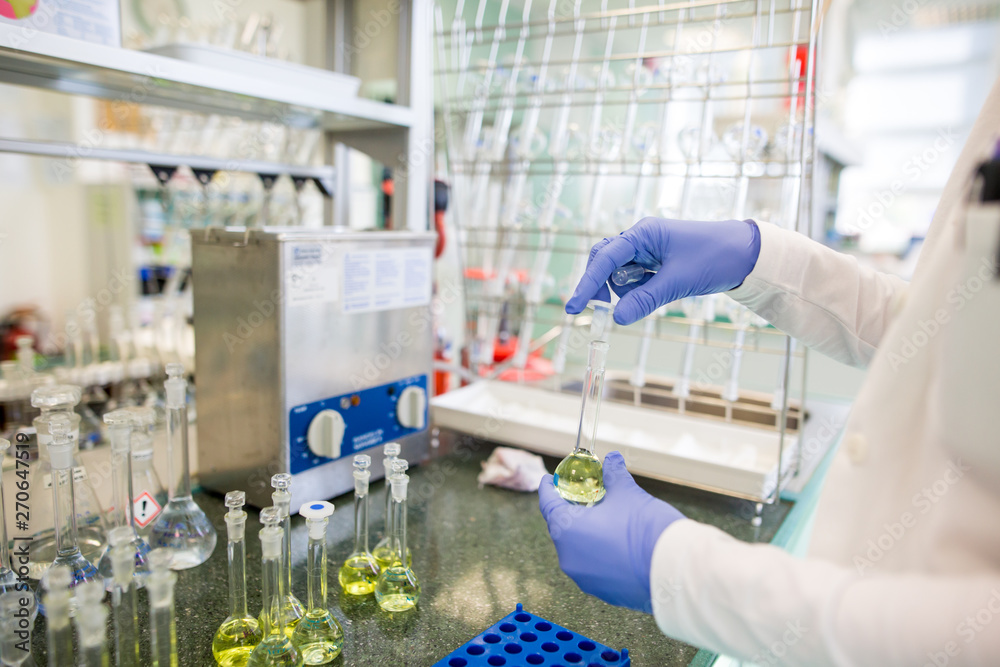 Flasks with liquids in a lab, pharmaceutical industry factory and ...