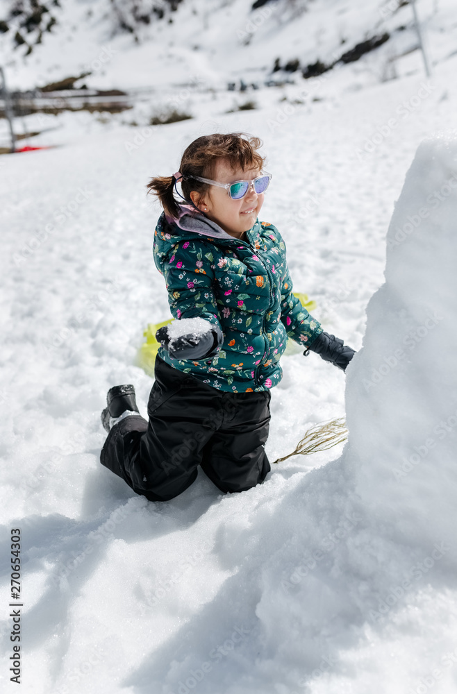 Little girl in the snow Stock Photo | Adobe Stock