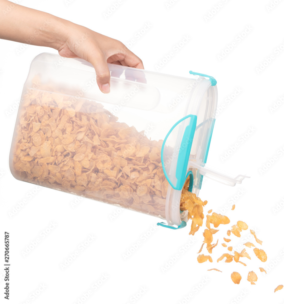 hand pouring cereals from container box isolated on white background ...
