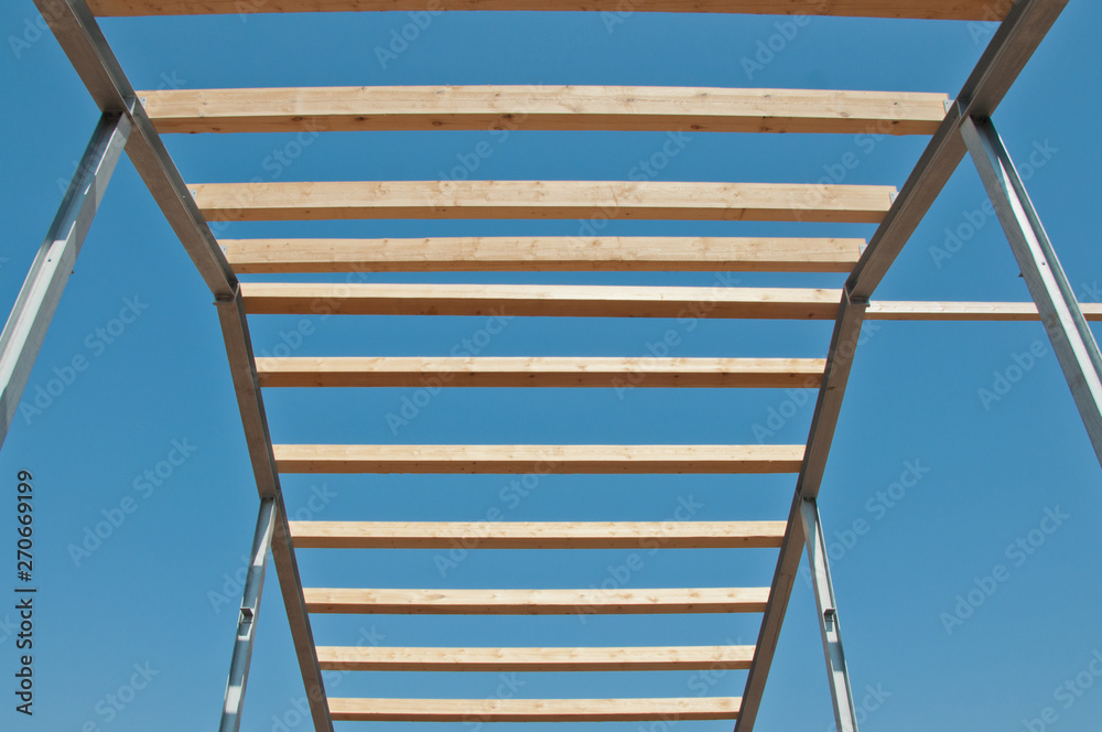 Wooden beams on steel structure for further construction. Metal frame ...