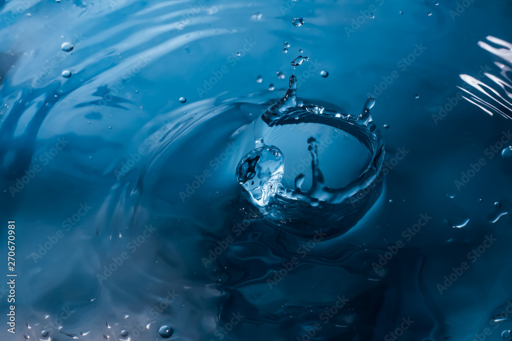 Water splash close-up. Drop of water. Blue water drop. Falling water ...