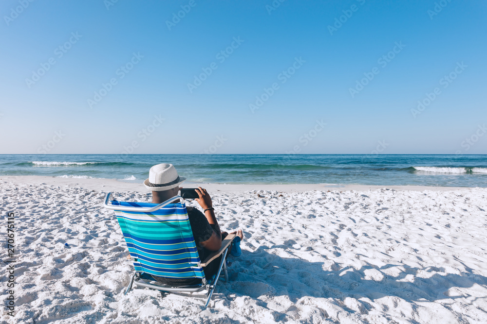 Person Relaxing On Beach
