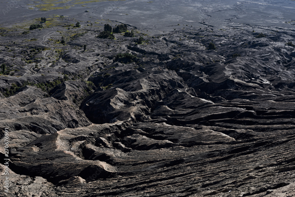 Rocky lava landscape view from the top of active volcano Mount Bromo ...