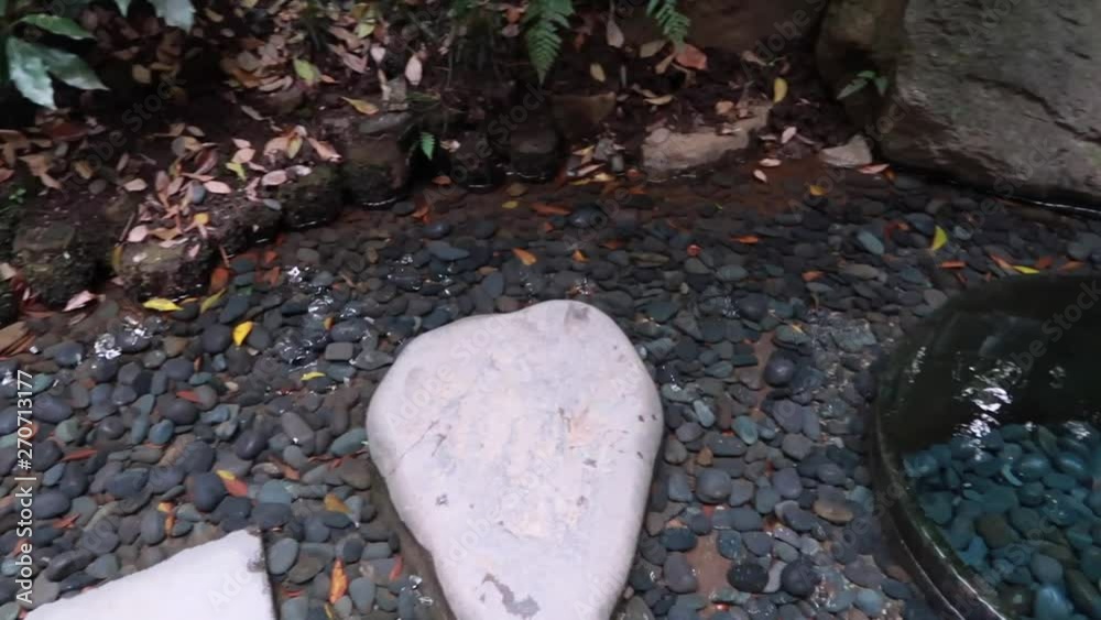 Natural clear spring water bubbling up from underground in the gardens ...