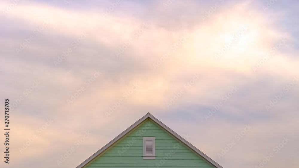 Panorama Top exterior of a house with view of the light green wall and ...