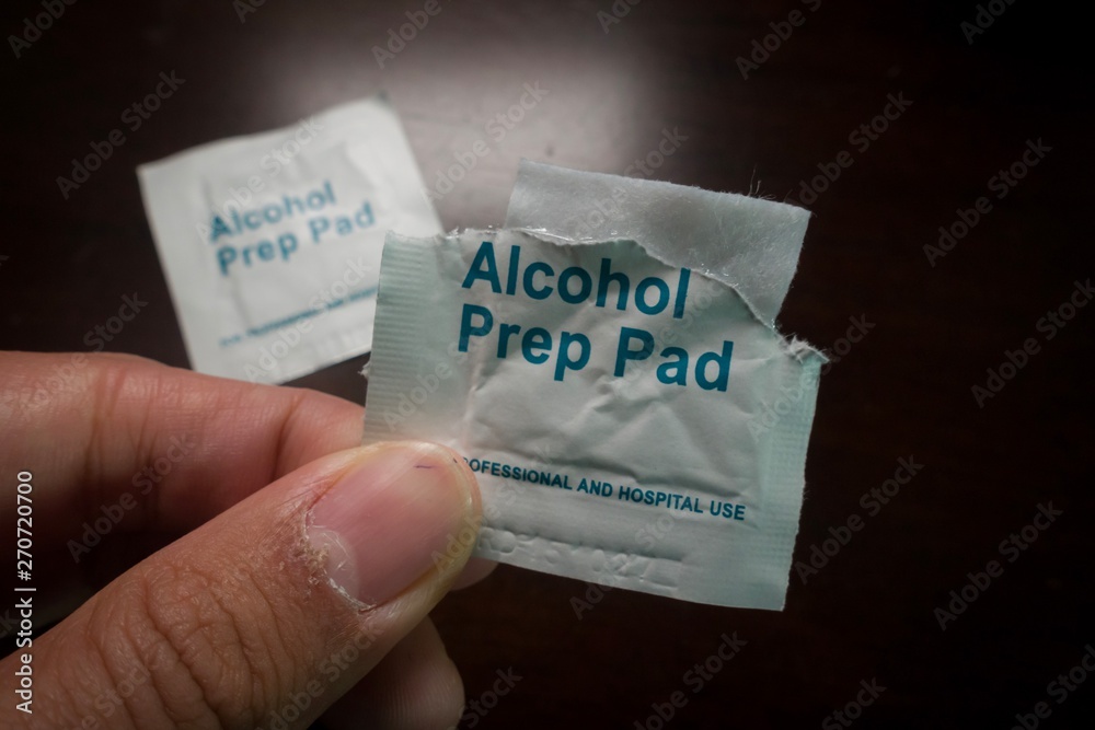 alcohol swab, isolated, used to sterilized skin area prior to injection ...