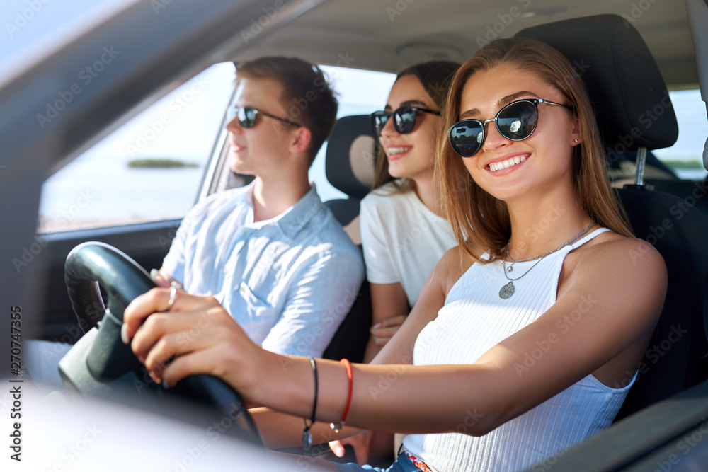 Group of friends rented a car on summer road trip and arrived to the ...