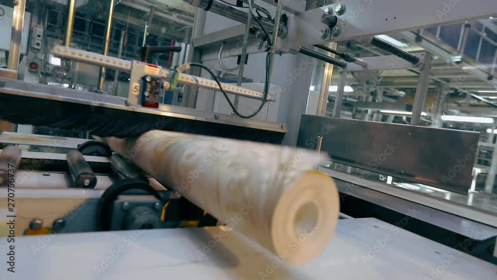 Vidéo Stock A roll of wallpaper and a conveyor line. Roll of wallpaper ...