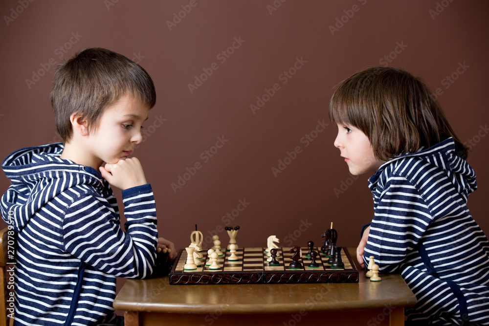 Little boy, playing chess. Smart kid, isolated, playing chess against ...