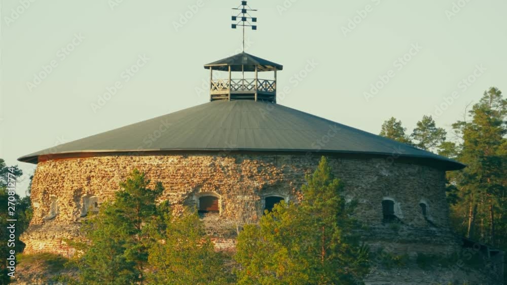 Moving away from an old round building from the middle ages that could ...