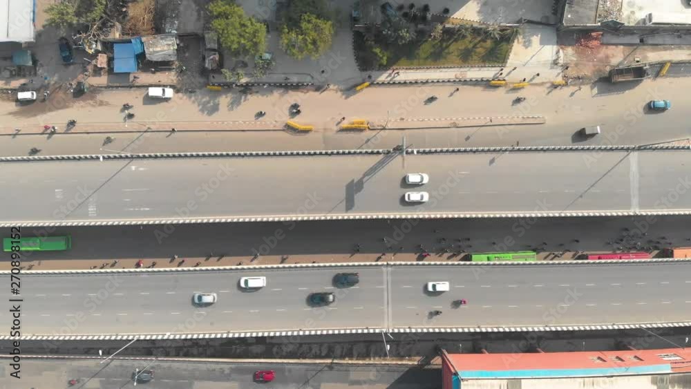 Electric rapid public transport in India, Vehicles moves along delhi ...