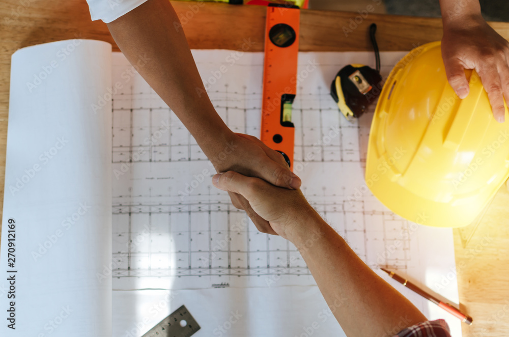 top view construction worker team contractor hand shake after finishing ...