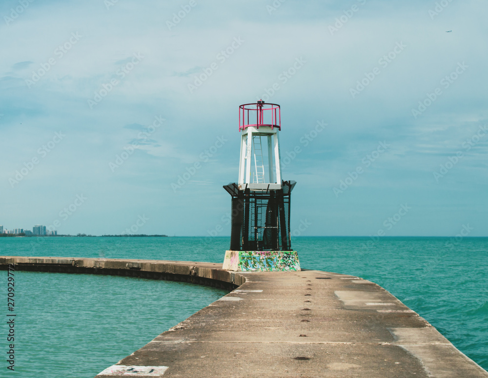 A watchtower is shown in the middle of a narrow path in the middle of a ...