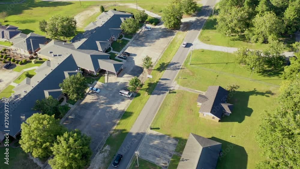 An aerial view of a typical suburban area with houses and single-storey ...