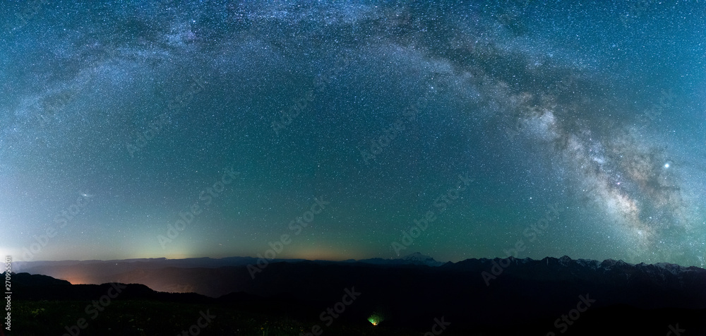 dark night sky with many stars and the milky way over the mountains ...