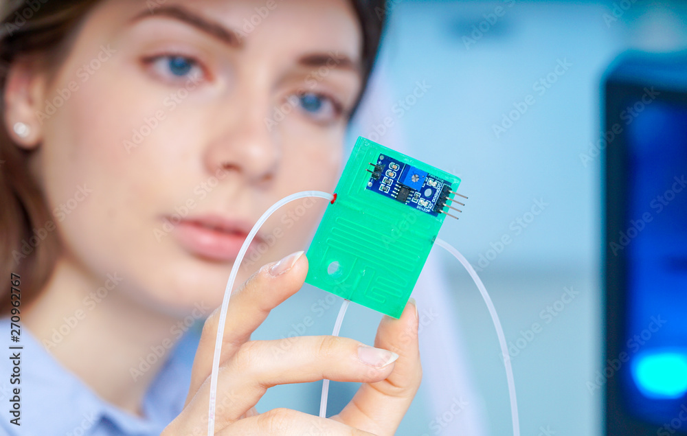 Girl holding polymers Bio-MEMS biomedical microelectromechanical ...