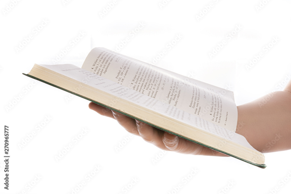 Woman's hand is holding book. Stock Photo | Adobe Stock