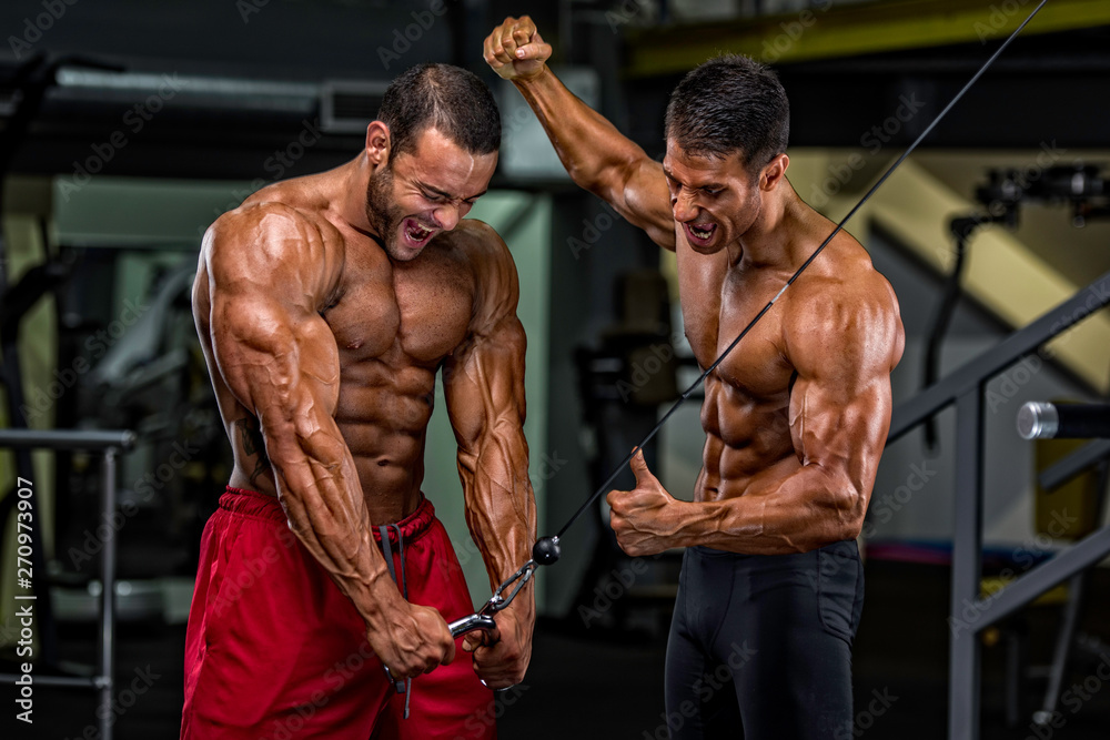 Bodybuilding Motivation. Two Bodybuilders Train Together at the Gym ...