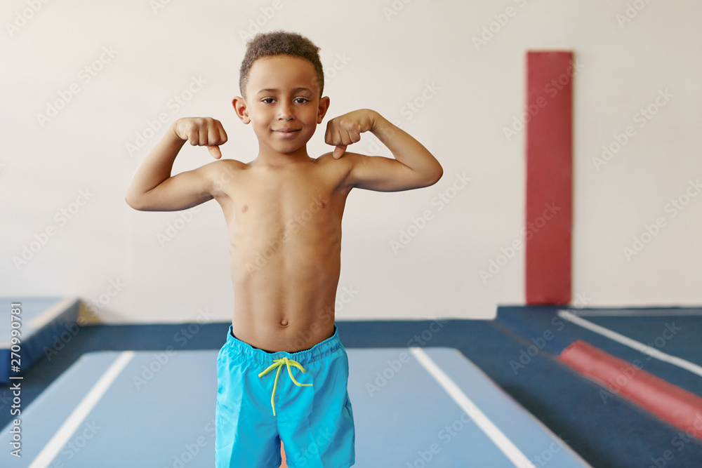 Indoor shot of handsome African American boy with athletic body and ...