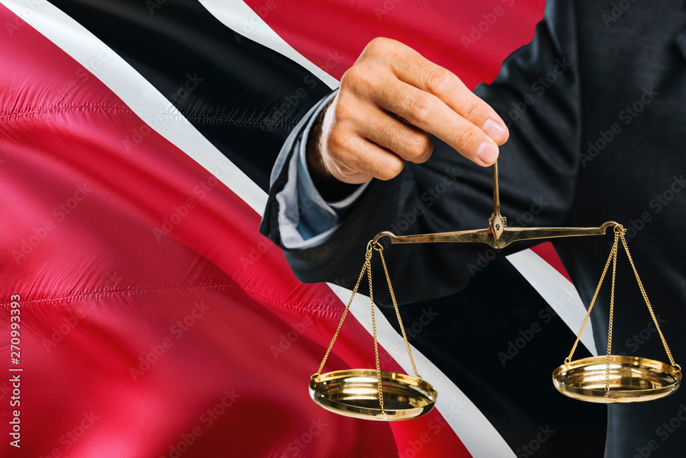 Judge is holding golden scales of justice with Trinidad And Tobago ...